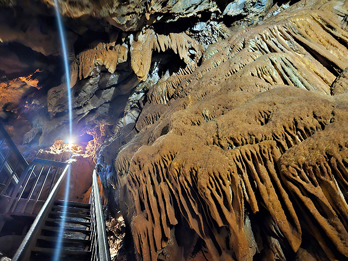 Golden-hued formations flow like honey frozen in time. This underground masterpiece makes the most elaborate wedding cake look positively boring.