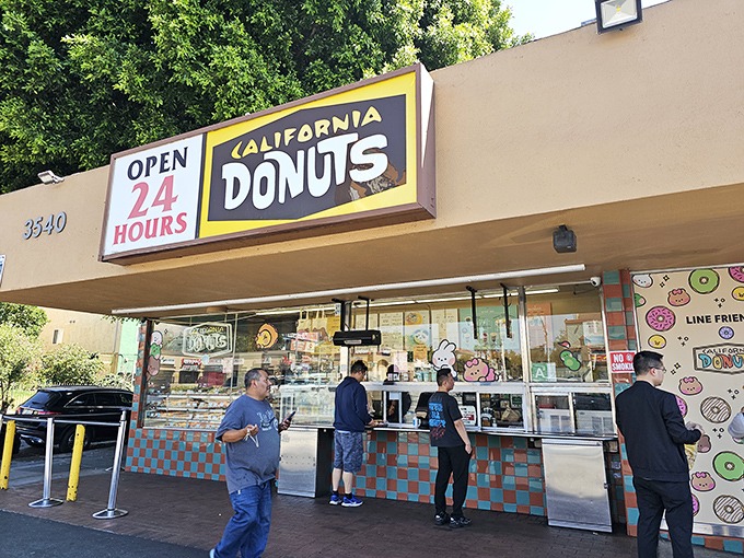 The customer queue at California Donuts moves with purpose. When donut desire strikes, nothing stands in the way.