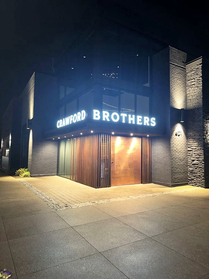 Night transforms Crawford Brothers into a glowing temple of beef, beckoning hungry pilgrims from miles around.