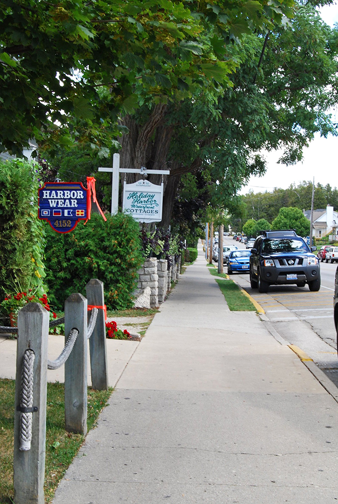 Harbor Wear sign marks the entrance to Fish Creek's delightful shopping district. Those nautical flags are speaking my language!