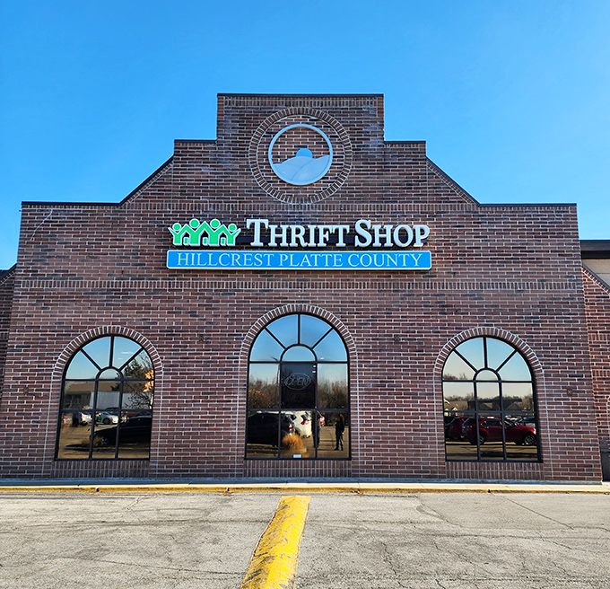 The elegant arch of Hillcrest's sign promises a more refined thrifting experience. Architectural details hint at treasures inside.