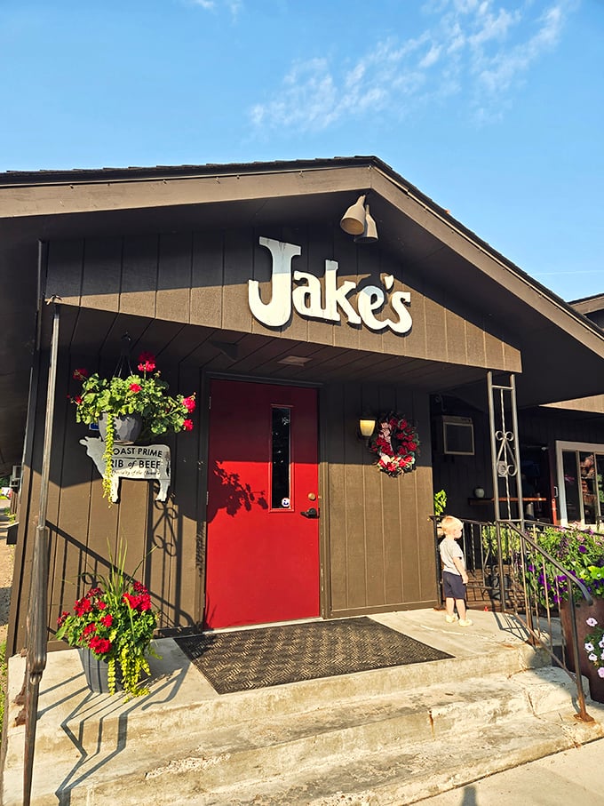 That bright red door at Jake's isn't subtle – it's practically shouting "Life-changing steaks happen here!"