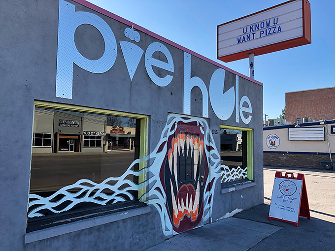 That painted snake gives this pizza joint some rock-and-roll attitude. The sign knows the truth: we always want pizza.