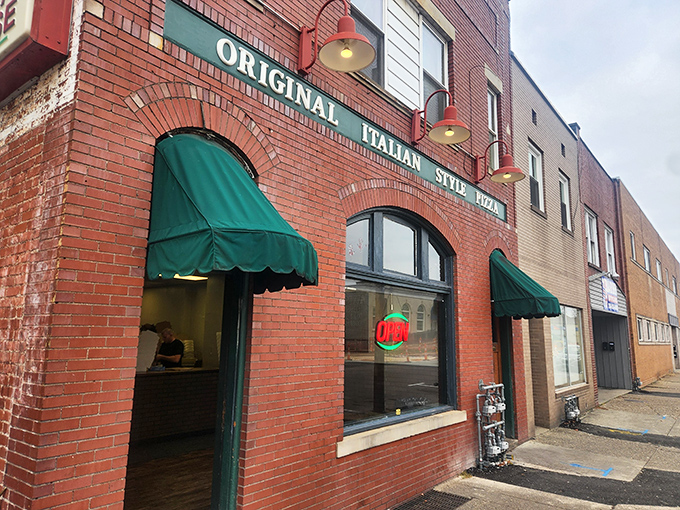 That brick facade and those green awnings hide pizza treasures that Pittsburgh locals will drive miles to enjoy.