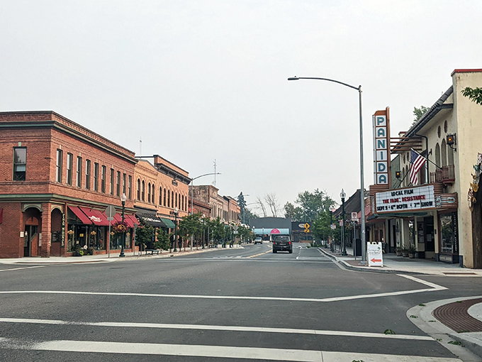 Tree-canopied streets create a peaceful atmosphere in Sandpoint, where natural beauty doesn't come with a premium price tag.