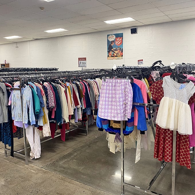 A rainbow of possibilities hangs in perfect order, just waiting for someone to give these clothes a new home.