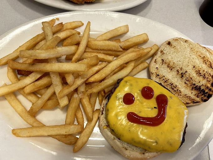 Someone drew a ketchup smile on this burger because it knows what joy it's about to bring to your day. Friendship never tasted so good.