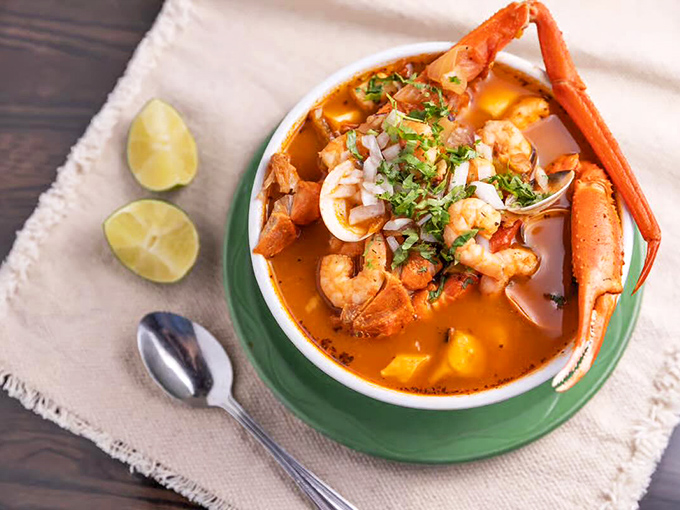 The 7 Seas Soup arrives like an oceanic expedition in a bowl, with crab claw waving hello from a broth so flavorful you'll consider drinking it straight.