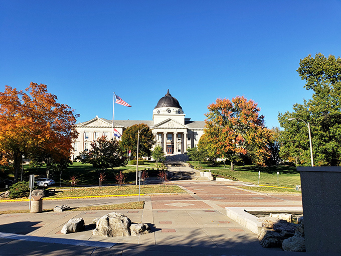 Academic Hall's stately dome and columns anchor Southeast Missouri State University's campus, especially stunning when framed by autumn's fiery maple trees.