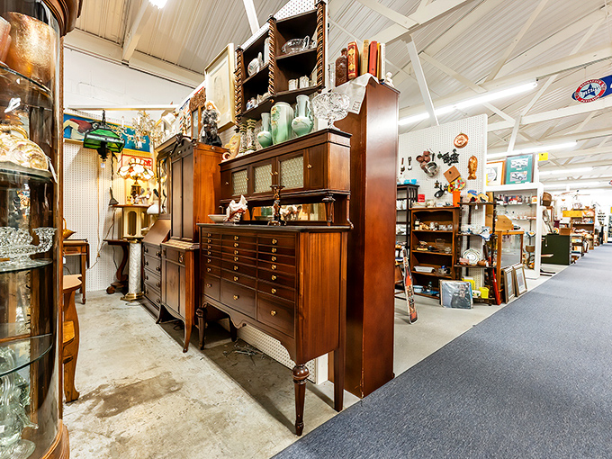 Magnificent wooden furniture stands at attention, waiting for its second act. That hutch has seen more family dinners than your favorite sitcom.
