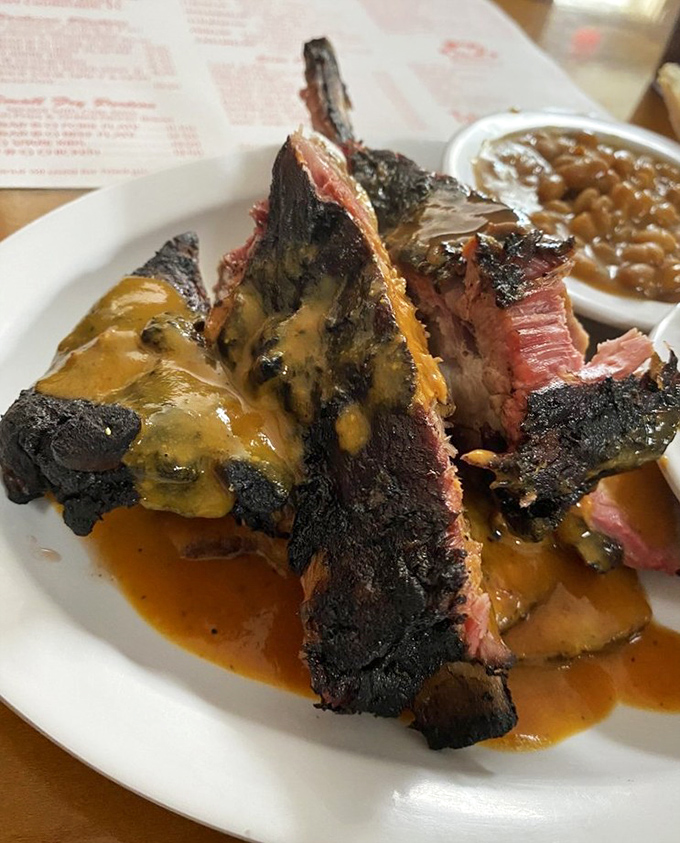 Barbecue alchemy: transforming tough cuts into tender, smoky masterpieces with a sauce that's been perfected over decades.