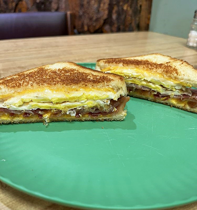 This sandwich isn't just breakfast between bread—it's architectural perfection with layers of bacon, egg, and cheese creating the Taj Mahal of morning handholds.
