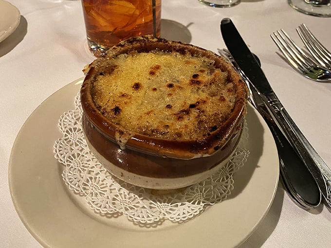 French onion soup that's worth the inevitable cheese pull photo op&mdash;a bubbling cauldron of comfort topped with a golden crown.