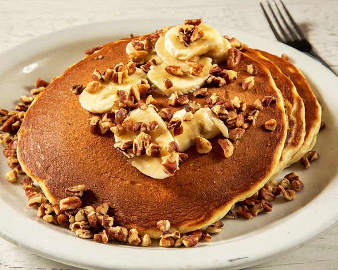 These banana nut pancakes aren't just breakfast, they're an event. Golden discs of joy topped with enough nuts to make a squirrel jealous.