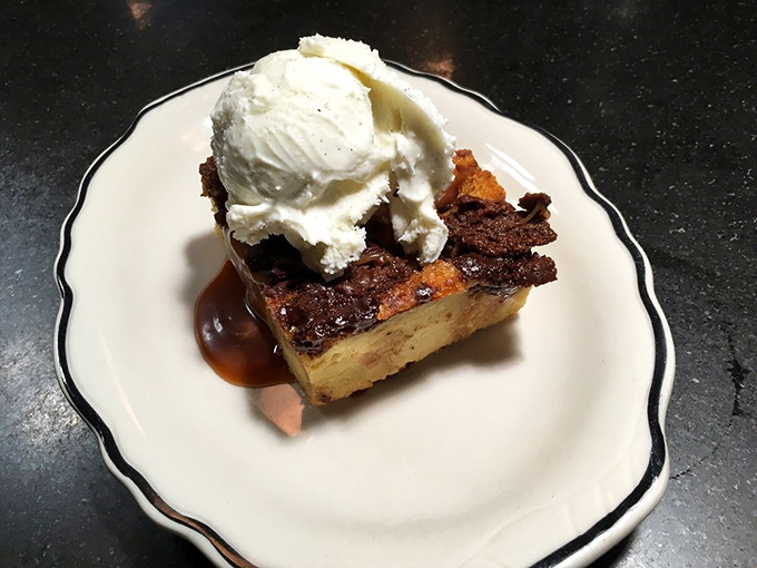 Bread pudding that makes you forget your diet resolutions. That ice cream melting into warm banana goodness is pure therapy.
