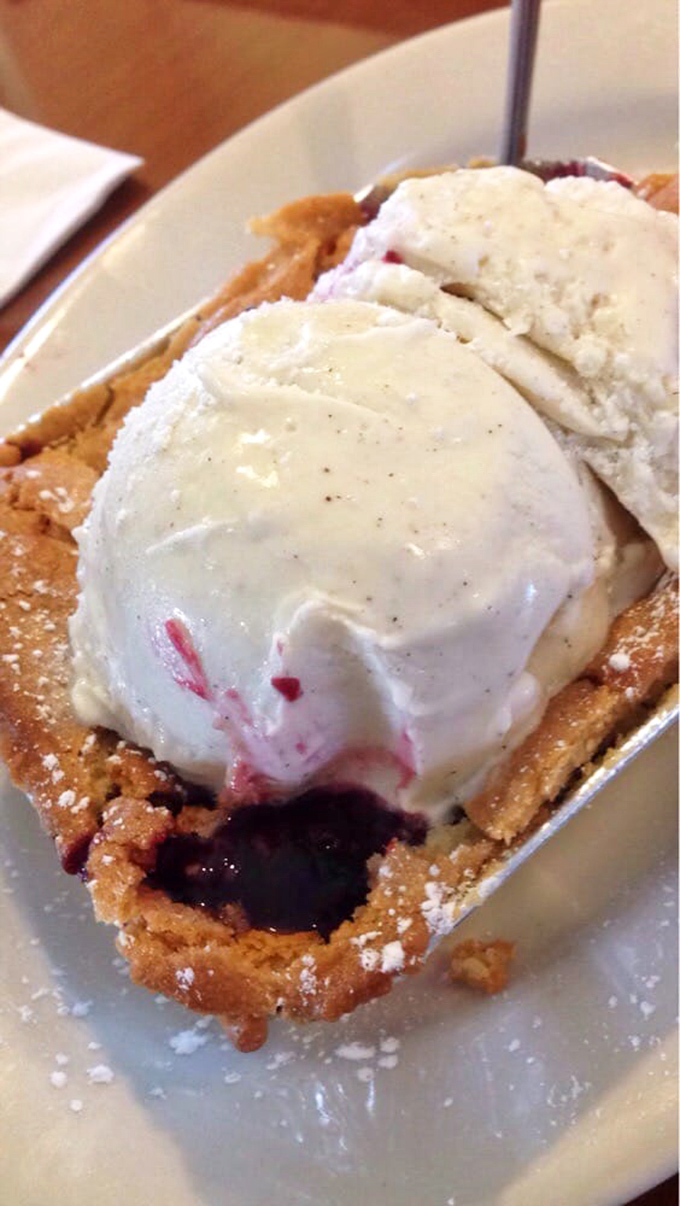 Dessert isn't an afterthought here&mdash;this berry cobbler with vanilla ice cream is the encore after a magnificent meat symphony.