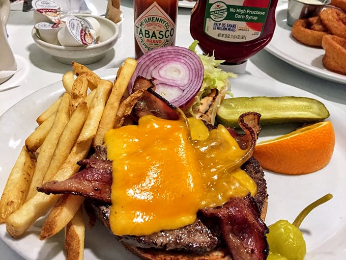 This isn't just a burger&mdash;it's an architectural marvel with bacon and cheese that requires both hands, several napkins, and absolutely no shame.