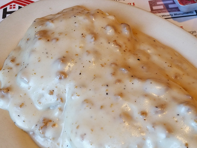 Country gravy cascading over biscuits like a warm, peppery avalanche. Breakfast doesn't get more soul-satisfying than this Midwestern classic.