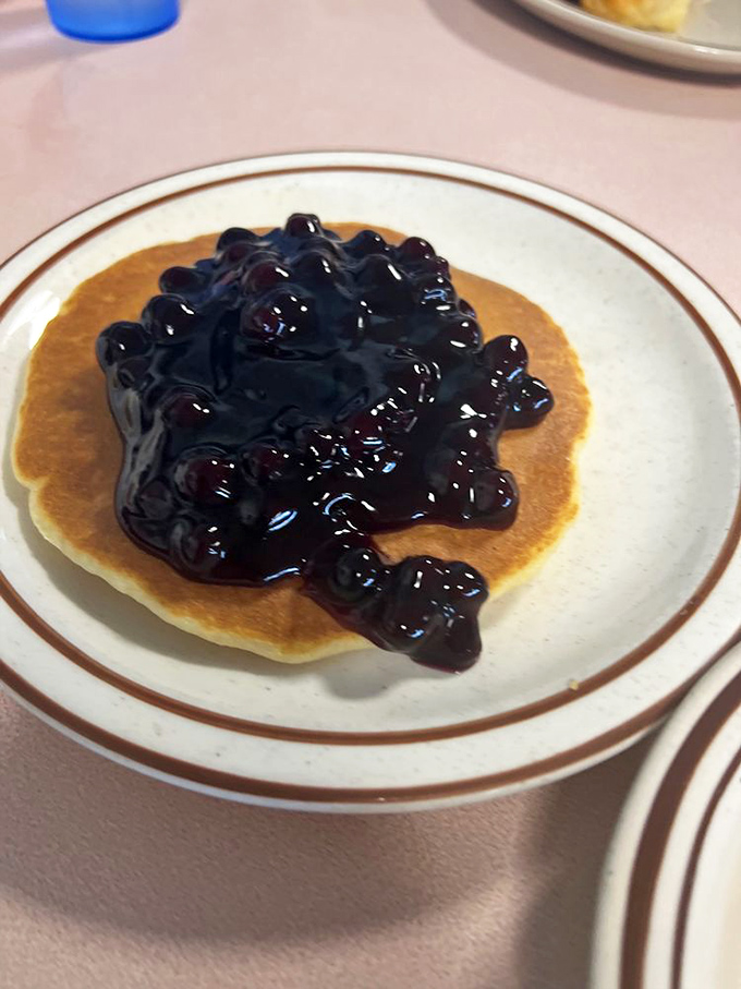 Blueberry pancakes that put ordinary versions to shame. Those bursts of purple-blue goodness are like flavor grenades in every bite.