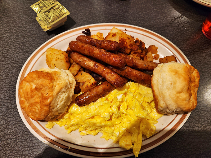 Breakfast architecture at its finest&mdash;golden biscuits, perfectly cooked sausage links, and eggs that practically wink at you from the plate.