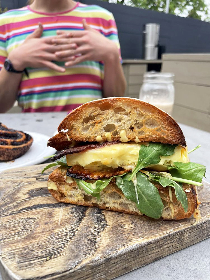 The legendary egg sandwich in all its glory – where soufflé-like eggs, Swiss cheese, and that magical bacon create a breakfast symphony worthy of a standing ovation.