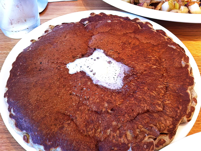 Buckwheat pancakes with a melting pat of butter &ndash; proof that simplicity, when executed perfectly, is the ultimate sophistication.