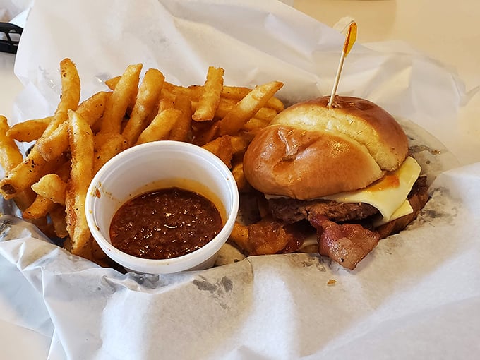This isn't just a burger &ndash; it's an engineering marvel of beef, cheese, and toasted bun, with a side of BBQ sauce for good measure.