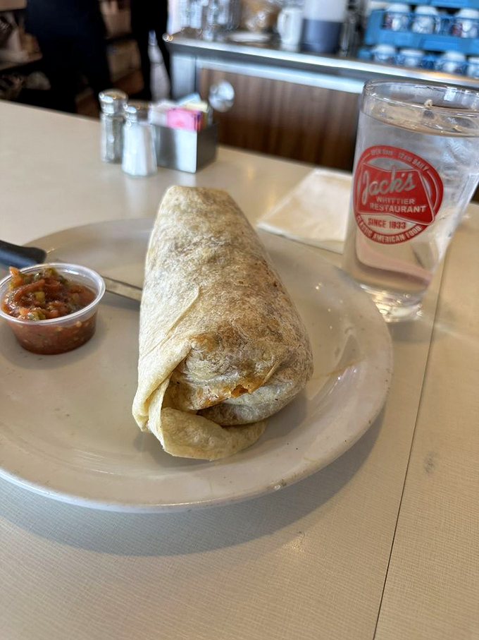 This burrito isn't just a meal; it's a commitment. Wrapped tight as a present, it promises all the satisfaction of home cooking without the dishes.