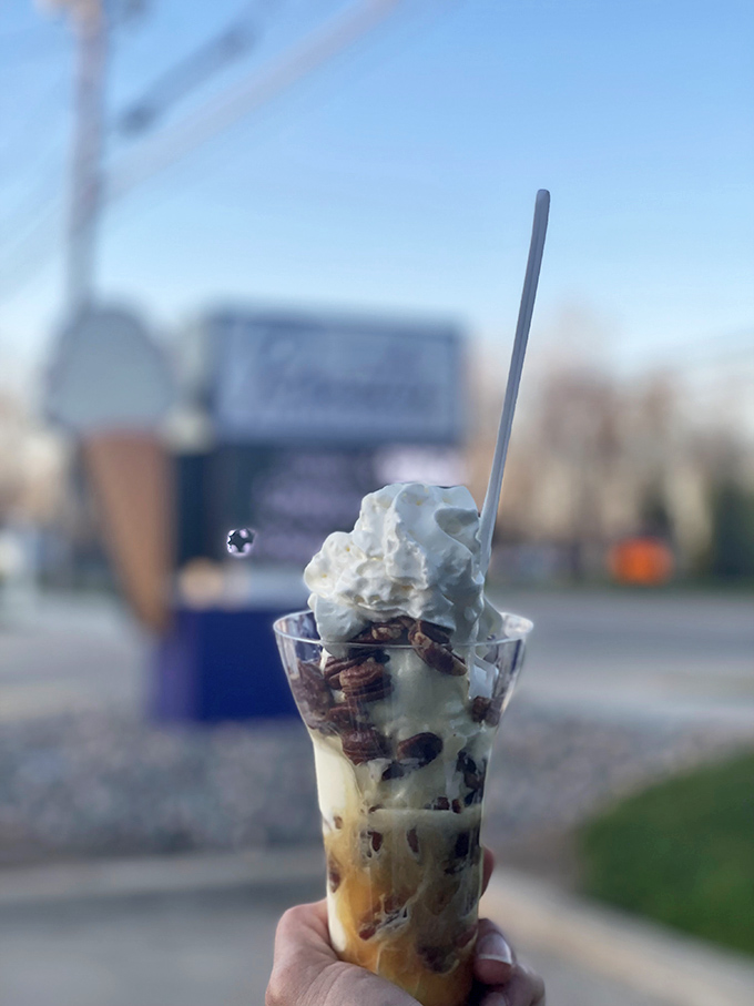 Standing proudly against the Brunswick backdrop, this cone isn't just dessert—it's a statement piece announcing "Today, I choose joy."