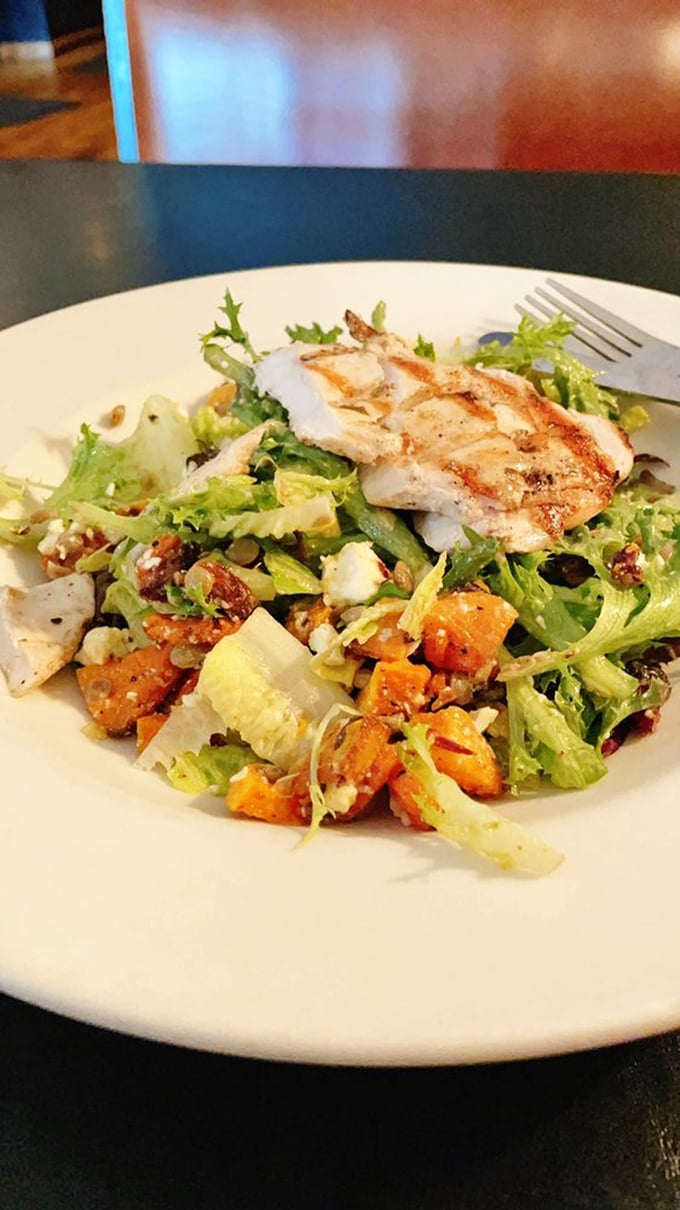 A salad that doesn't apologize for being delicious &ndash; grilled chicken atop fresh greens with roasted butternut squash and tangy dressing.