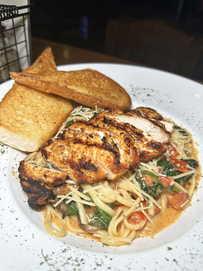Blackened chicken perched atop a swirl of pasta swimming in creamy sauce &ndash; comfort food that's dressed up for a night on the town.