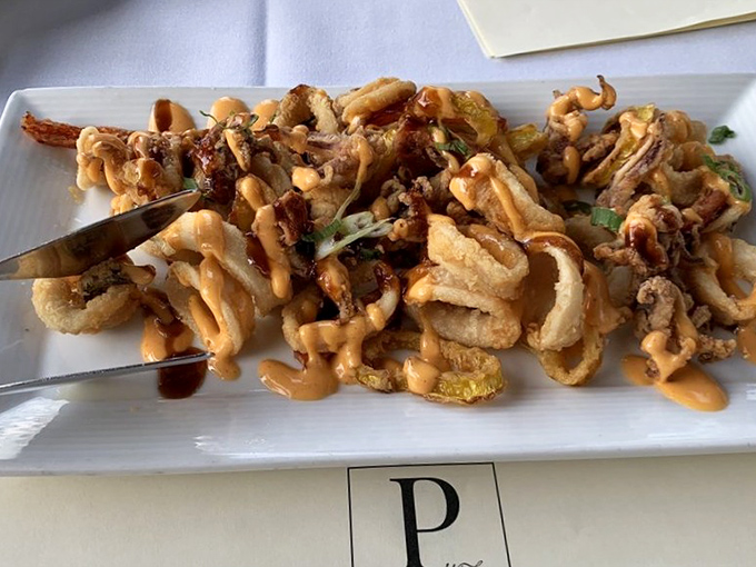 Calamari that doesn't require the workout your jaw usually gets at lesser establishments. Crispy, tender, and unapologetically addictive.