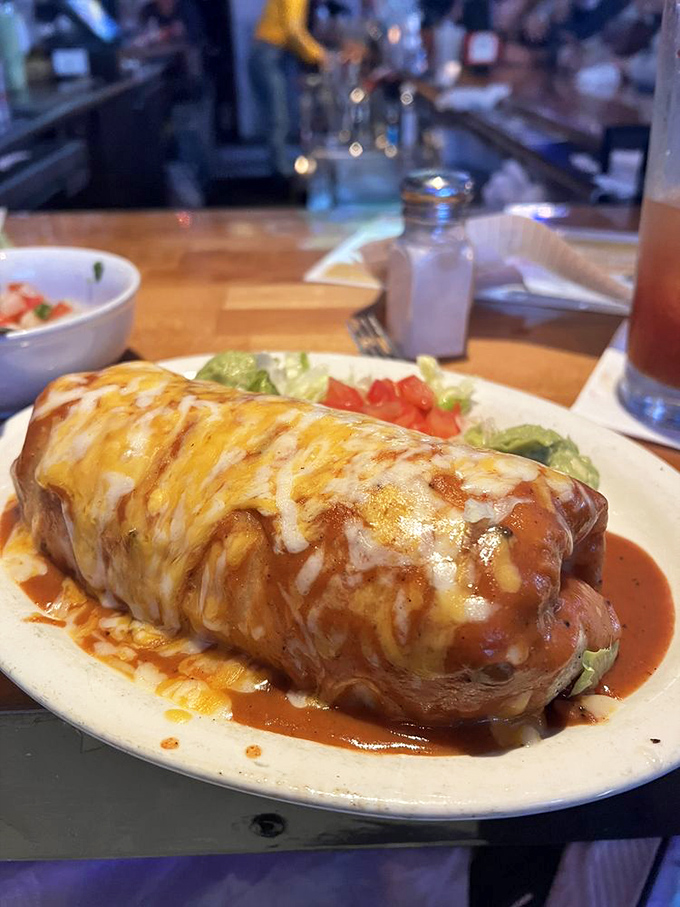 The wet burrito: where cheese meets sauce in a relationship so perfect it should have its own reality show.