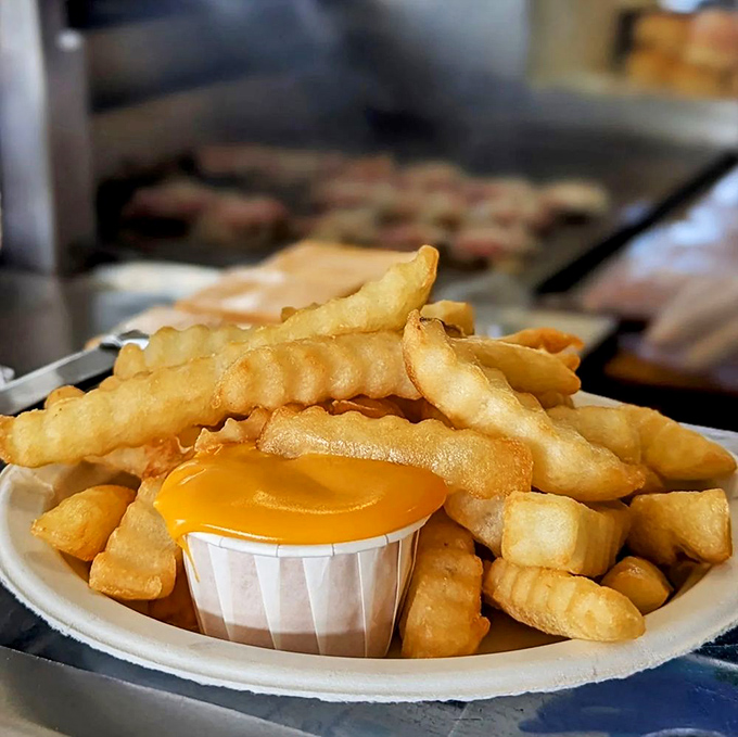 Golden, crispy fries with that little paper cup of cheese—a relationship more perfect than most Hollywood marriages.