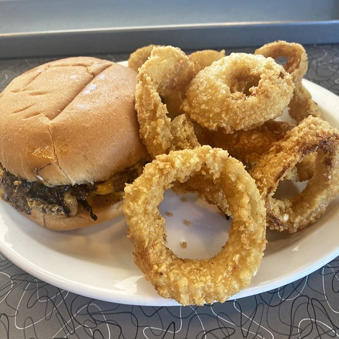 Those golden onion rings form a crispy halo around that burger&mdash;proof that sometimes the side dish deserves equal billing with the star.