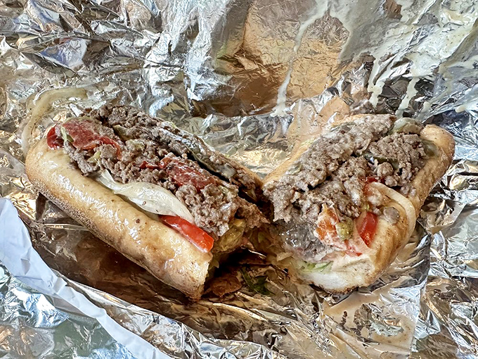 The cheesesteak hoagie, unwrapped like a present, reveals that magical marriage of seasoned beef, melted cheese, and fresh toppings that makes Philly famous.