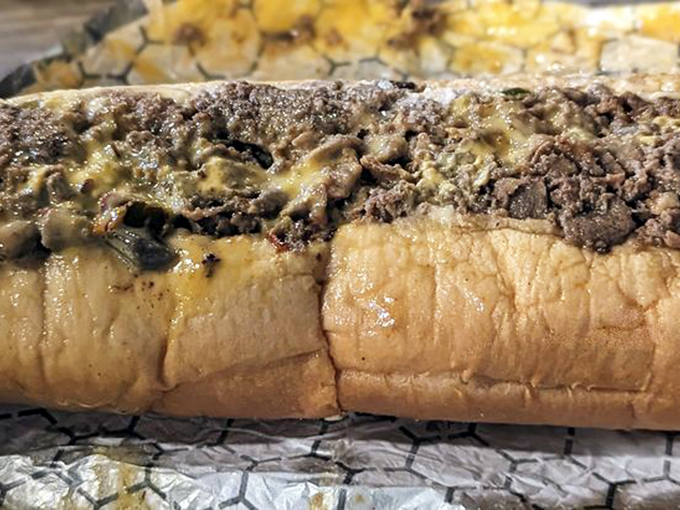 The cross-section reveals all: this isn't just a sandwich, it's architectural genius. Layers of flavor stacked with Philly precision.