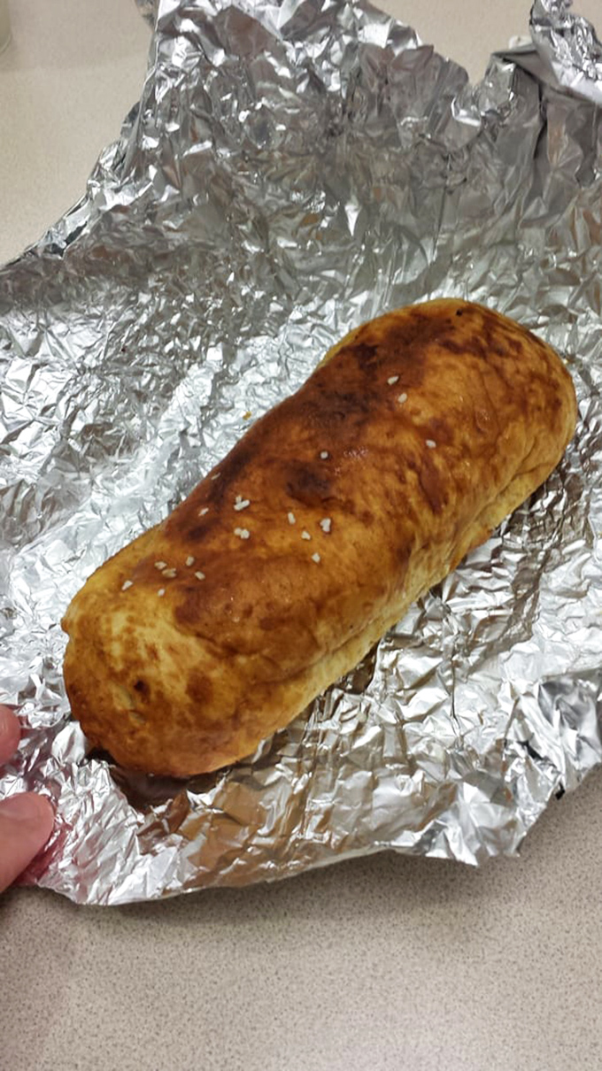 The pretzel dog—where German baking tradition meets American ballpark ingenuity. This hand-held masterpiece makes regular hot dogs question their life choices.