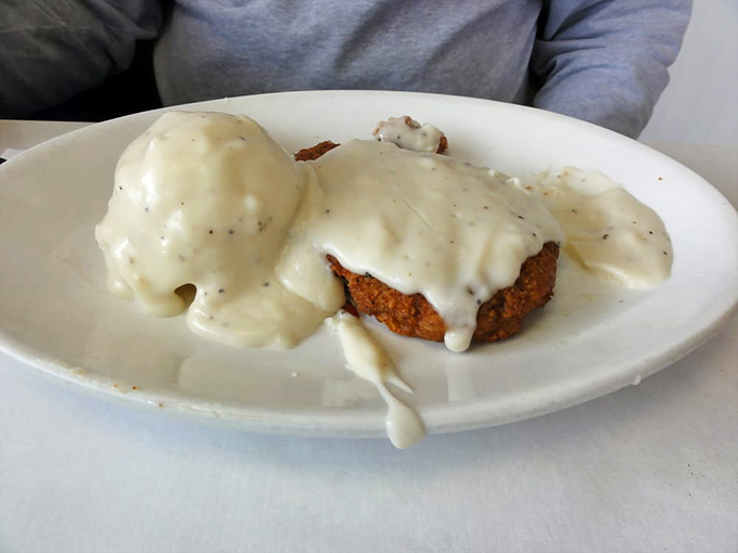 Chicken fried steak smothered in gravy so good you'll want to write home about it. Country comfort food that hugs your soul from the inside. 