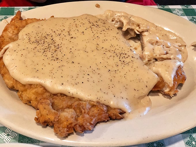 Country-fried steak swimming in gravy so good you'll consider drinking it like soup when no one's looking.