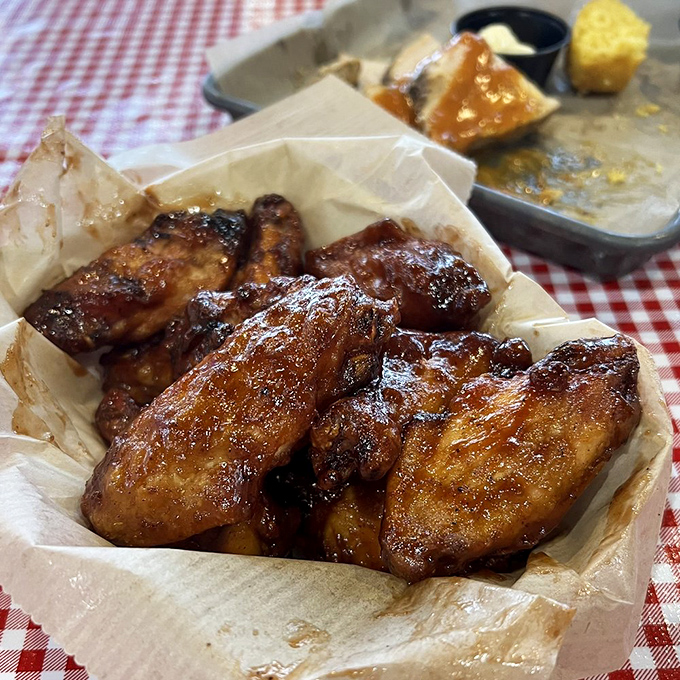 These chicken wings aren't just smoked—they're transformed. That glorious mahogany sheen isn't vanity; it's flavor you can actually see.