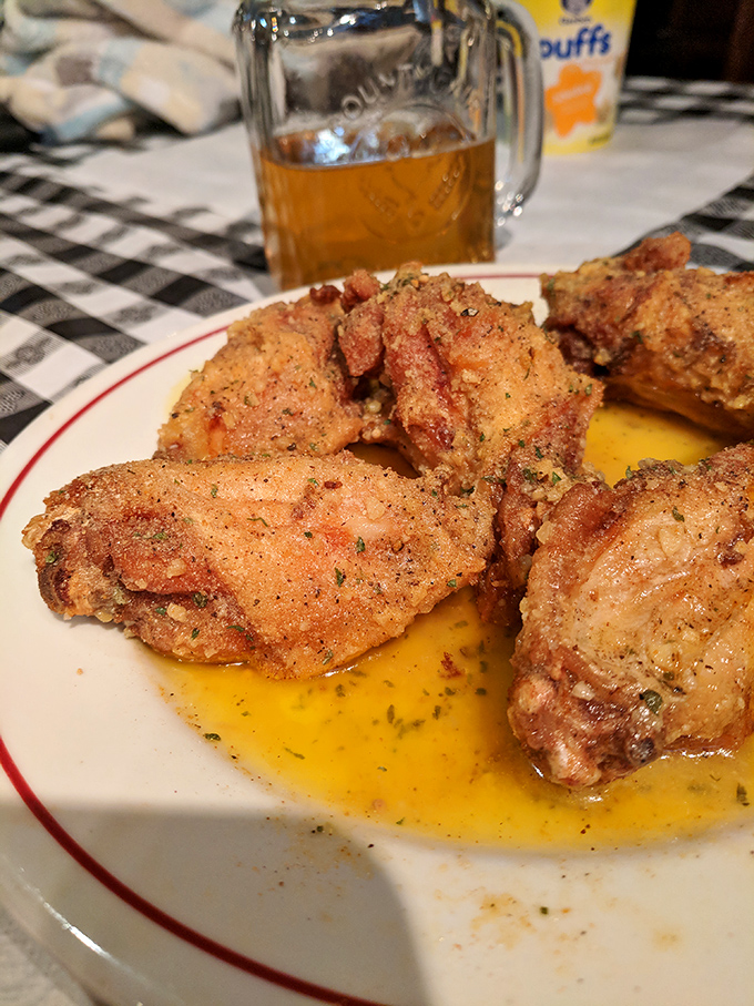 These aren't just chicken wings &ndash; they're crispy, golden-brown tickets to flavor town, glistening with buttery goodness that demands a cold beer companion.