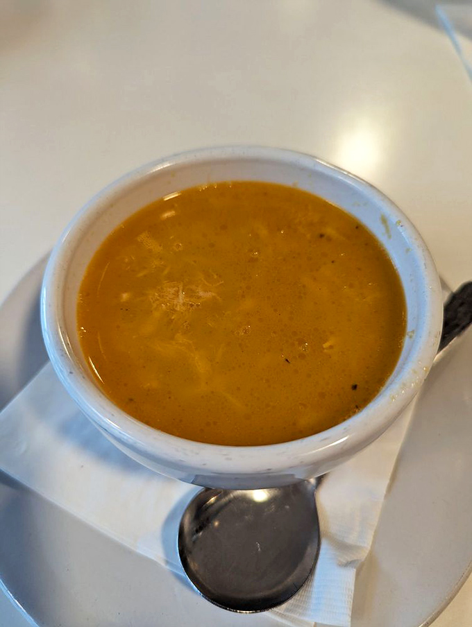 This chicken and rice soup doesn't just warm your stomach&mdash;it hugs your soul like your grandmother after you've been away too long.