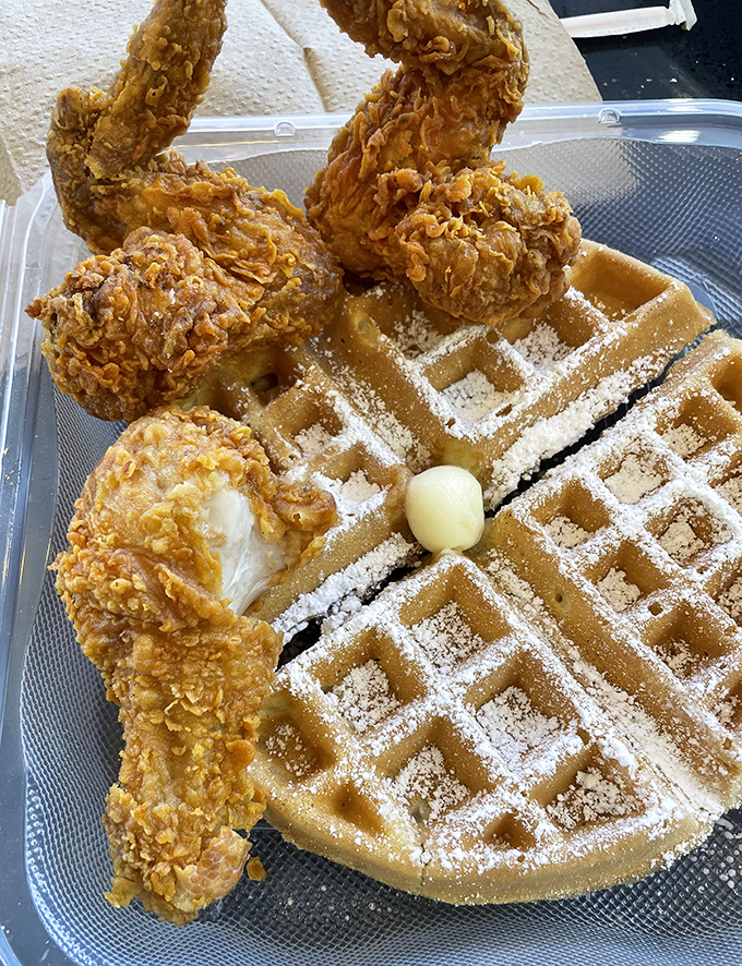 The classic duo that proves opposites really do attract: crispy, savory fried chicken perched atop a golden waffle dusted with powdered sugar.