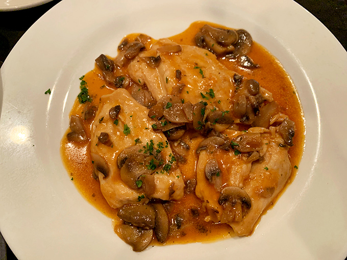 Chicken Marsala that's having a passionate love affair with mushrooms while swimming in a sauce you'll want to bottle and take home.