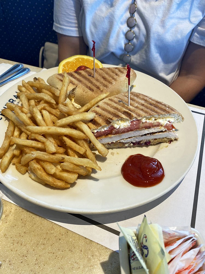 The humble panini achieves sandwich greatness when pressed to perfection and paired with fries so golden they deserve their own Fort Knox.