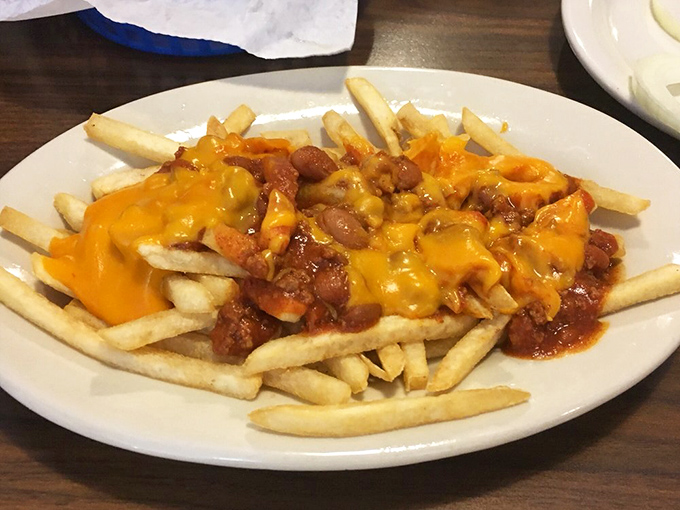 Chili cheese fries that laugh in the face of diet plans. The holy trinity of potatoes, beef, and cheese creates a dish worth every delicious calorie.