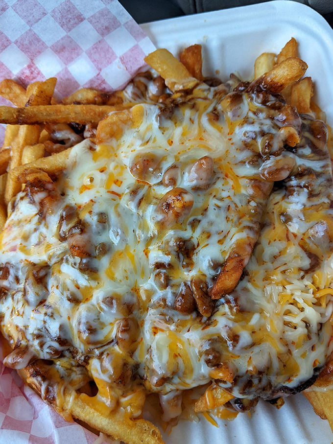 Chili cheese fries that require both a fork and a moment of silent appreciation&mdash;a gooey, savory mountain that turns a side dish into the main event. 