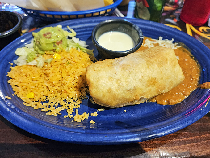This golden-fried chimichanga isn't just dinner&mdash;it's edible architecture, a crispy fortress protecting a treasure of savory fillings.