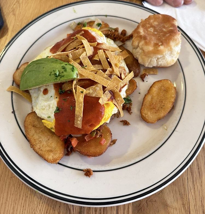 Southwestern breakfast artistry featuring eggs, avocado, and tortilla strips. The kind of dish that makes you want to lick the plate when nobody's looking.